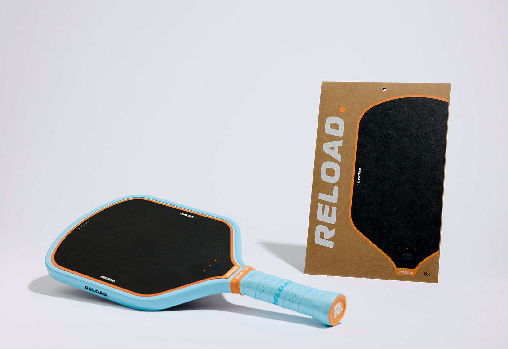 Reload - the pickleball paddle system with a replaceable surface